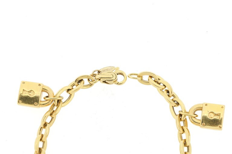 Modern 18 Karat Gold Padlock and Key Charm Bracelet For Sale at 1stDibs
