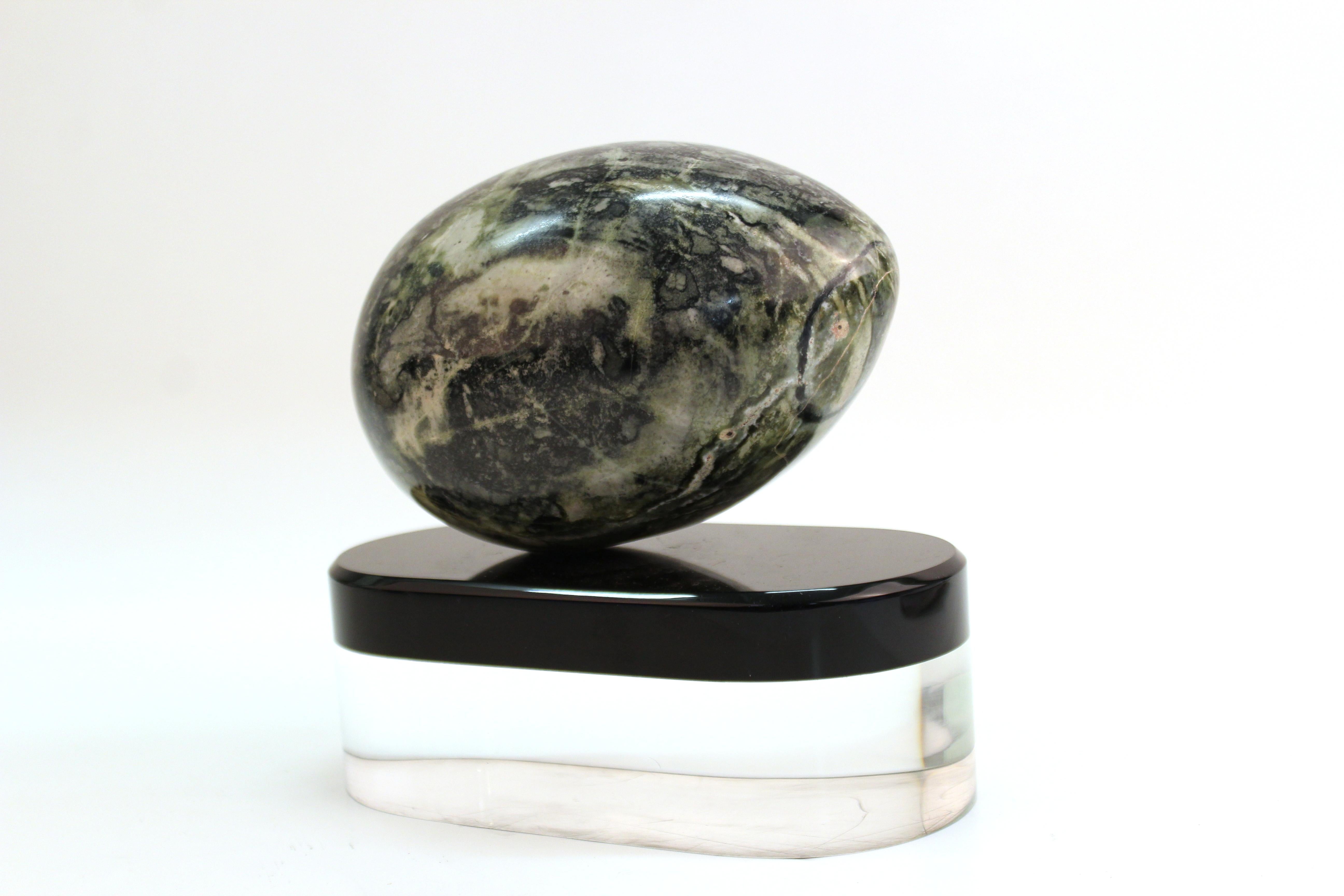 Modern Carved Stone Egg Sculpture Atop Black and Transparent Resin Base ...