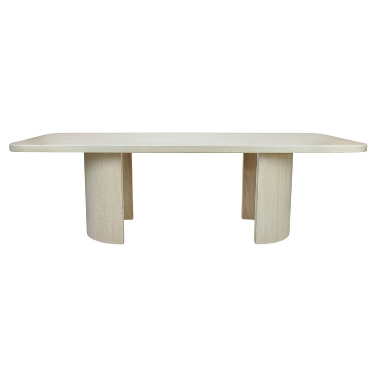 white rounded rectangle dining table
