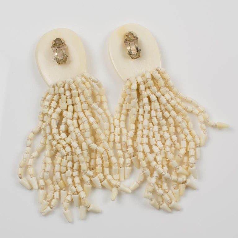 Monies Dangle White Bone Clip Earrings at 1stDibs