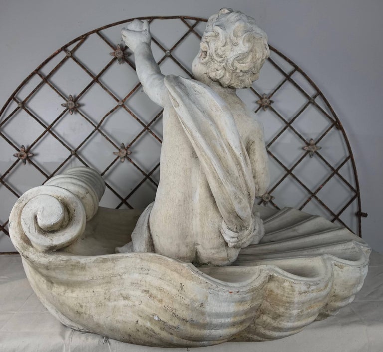 Monumental Garden Cherub Sitting on Large Shell with Apple at 1stDibs
