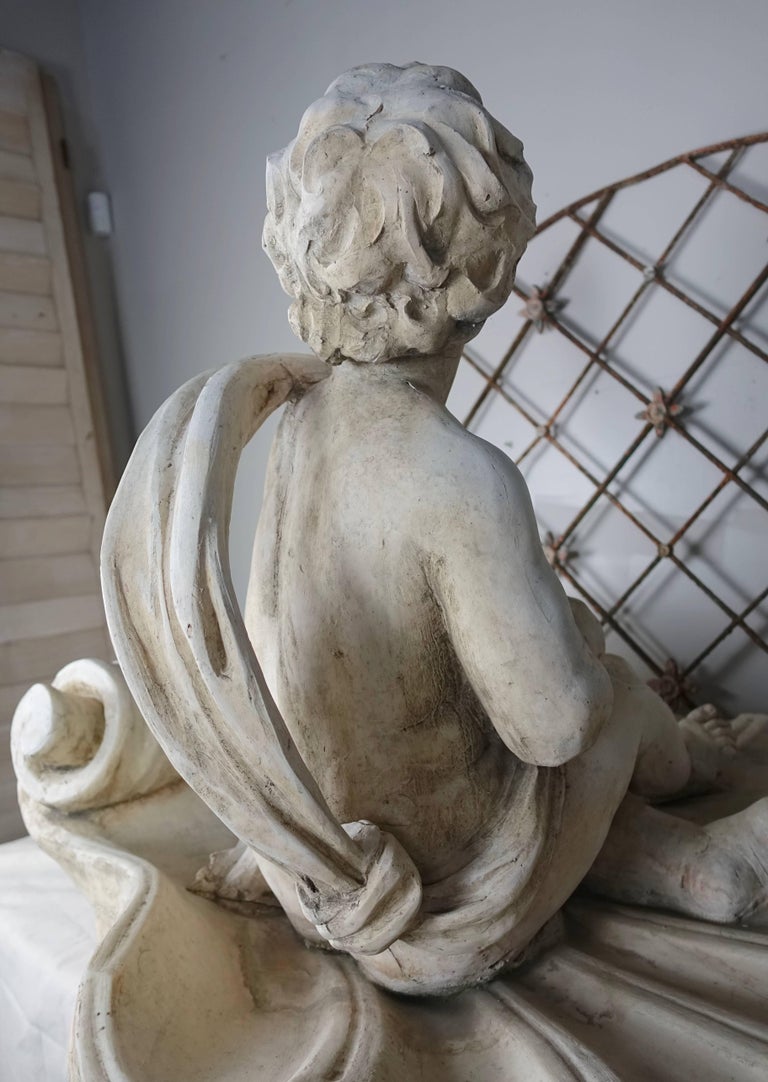 Monumental Garden Cherub Sitting on Large Shell with Apple at 1stDibs