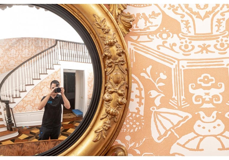 Monumental Gilt and Ebonized Convex Mirror with Eagle For Sale at 1stDibs