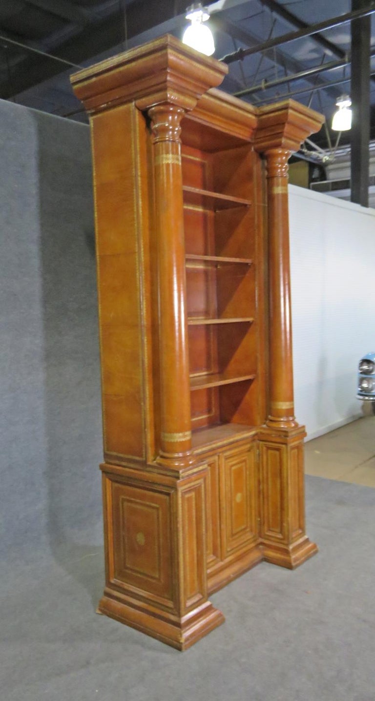 Monumental Maitland Smith Gold Tooled Leather Wrapped Bookcase at 1stDibs
