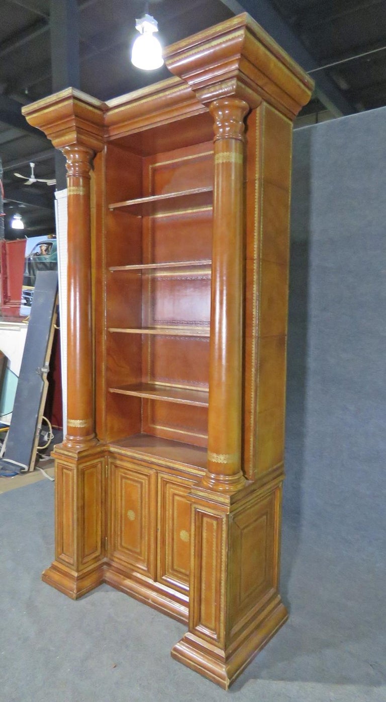 Monumental Maitland Smith Gold Tooled Leather Wrapped Bookcase at 1stDibs