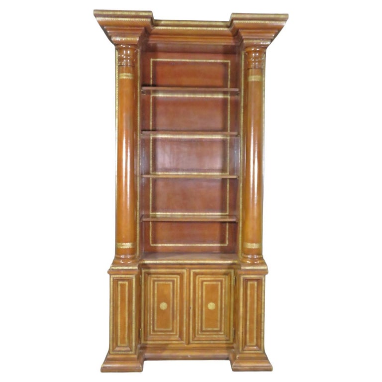 Monumental Maitland Smith Gold Tooled Leather Wrapped Bookcase at 1stDibs