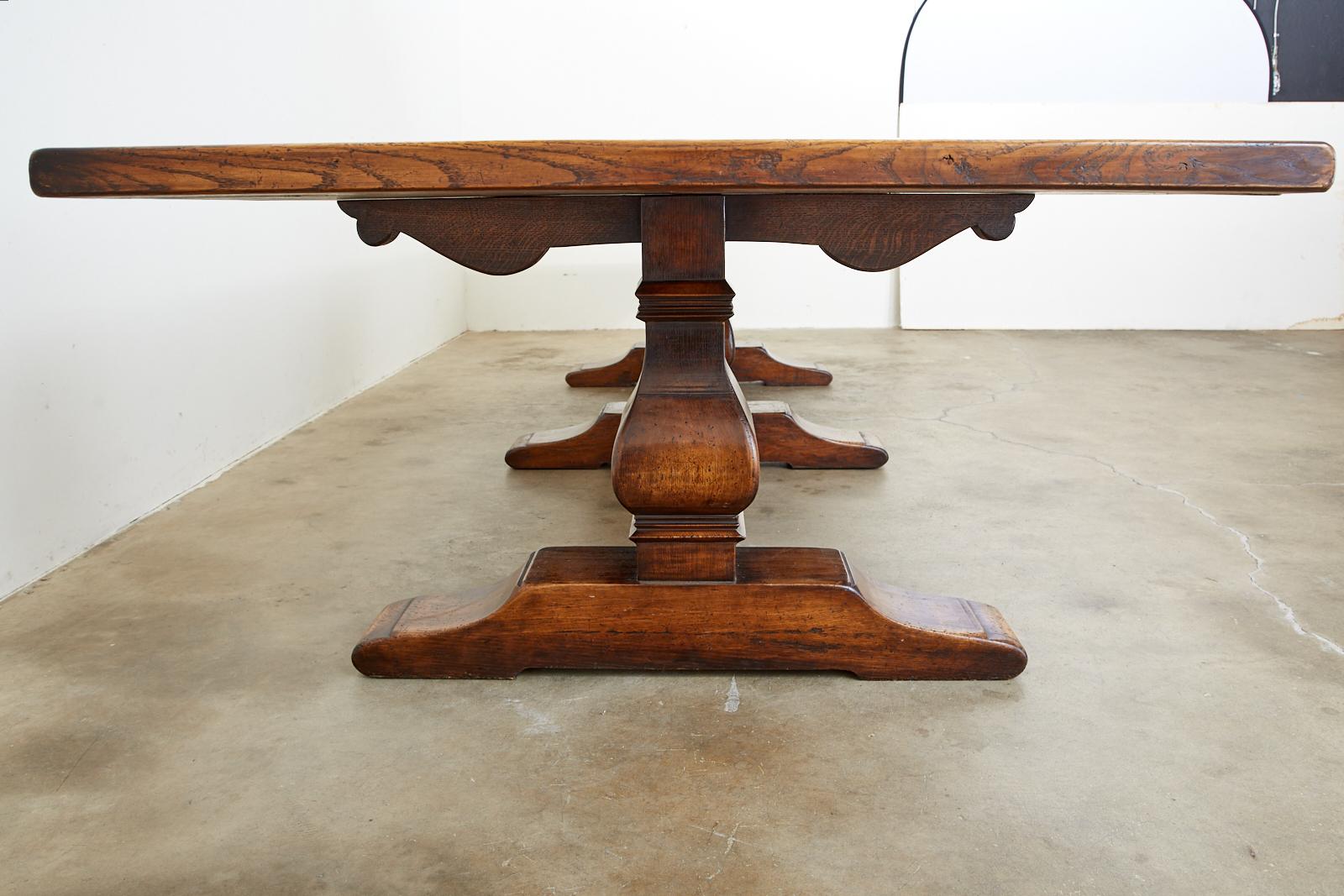 Monumental Triple Pedestal Oak Trestle Dining Table at 1stDibs