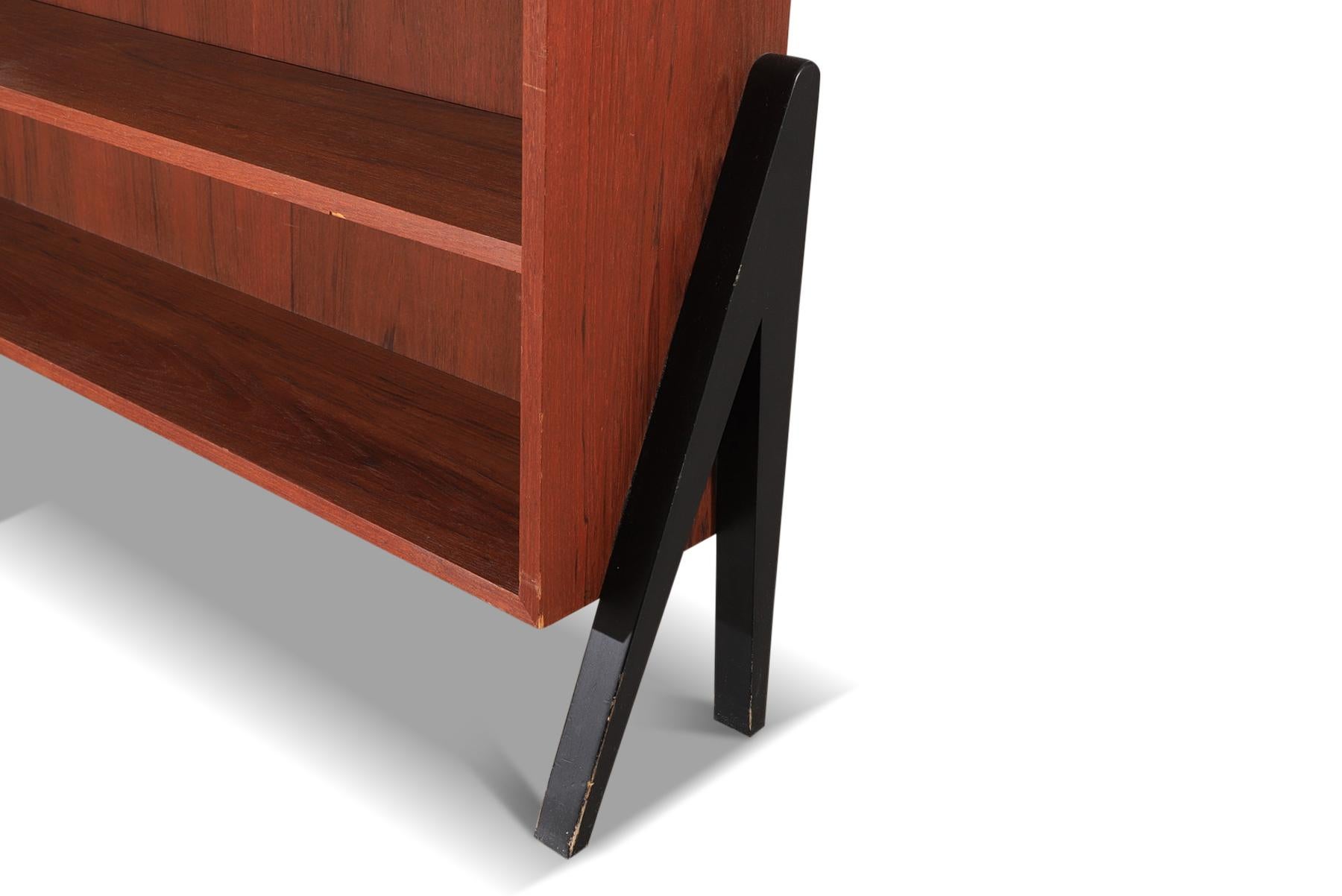 Narrow Teak Bookcase With Black v Shaped Legs For Sale at 1stDibs