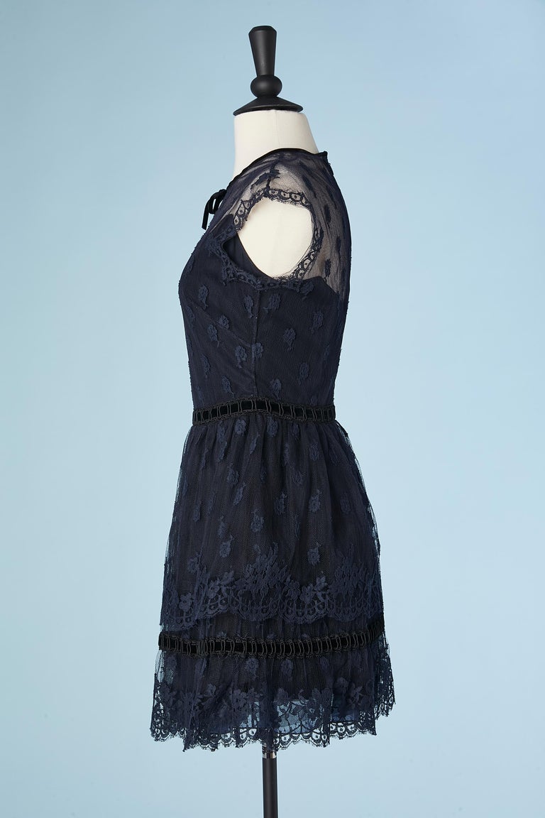 Navy blue cocktail dress in lace with black ribbons and ruffles ...