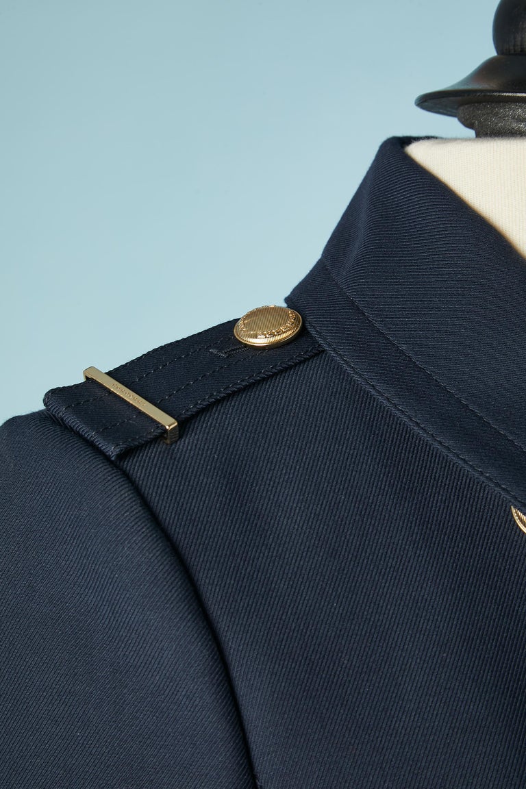 Navy blue wool officer double-breasted jacket and gold metal button ...