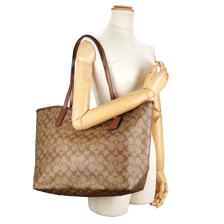 Coach - Sac porté épaule « City Fourre-tout » en toile marron avec ...