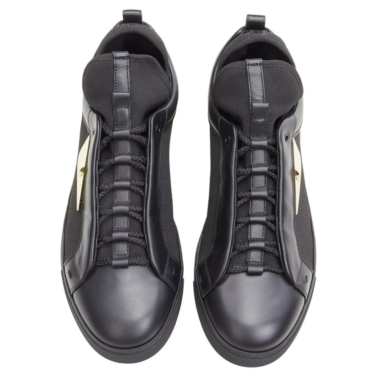 new FENDI Monster Bug Eye gold metal plate black low top sneaker UK9 EU43 For Sale at 1stDibs