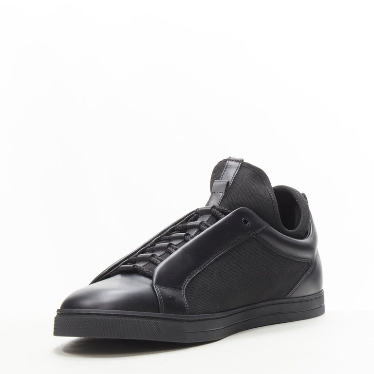 new FENDI Monster Bug Eye gold metal plate black low top sneaker UK9 EU43 For Sale at 1stDibs