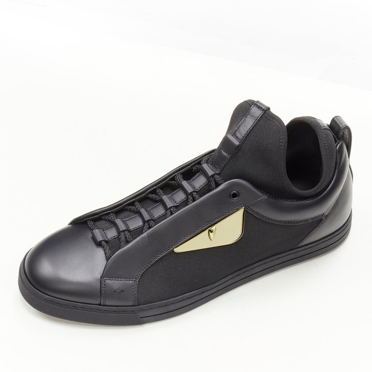 new FENDI Monster Bug Eye gold metal plate black low top sneaker UK9 EU43 For Sale at 1stDibs