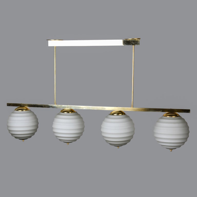 New Italian Fixture with Four Pale Taupe Globes on Horizontal Brass Bar ...