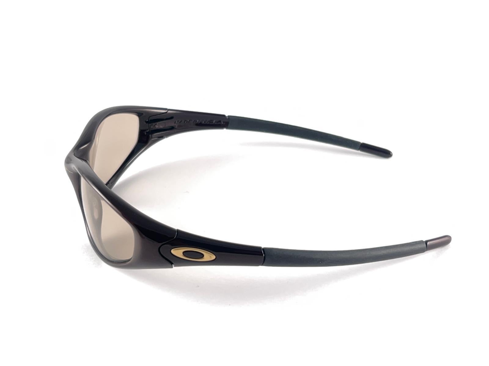 New Vintage Oakley Straight Metallic Burgundy 2000's Sunglasses at 1stDibs