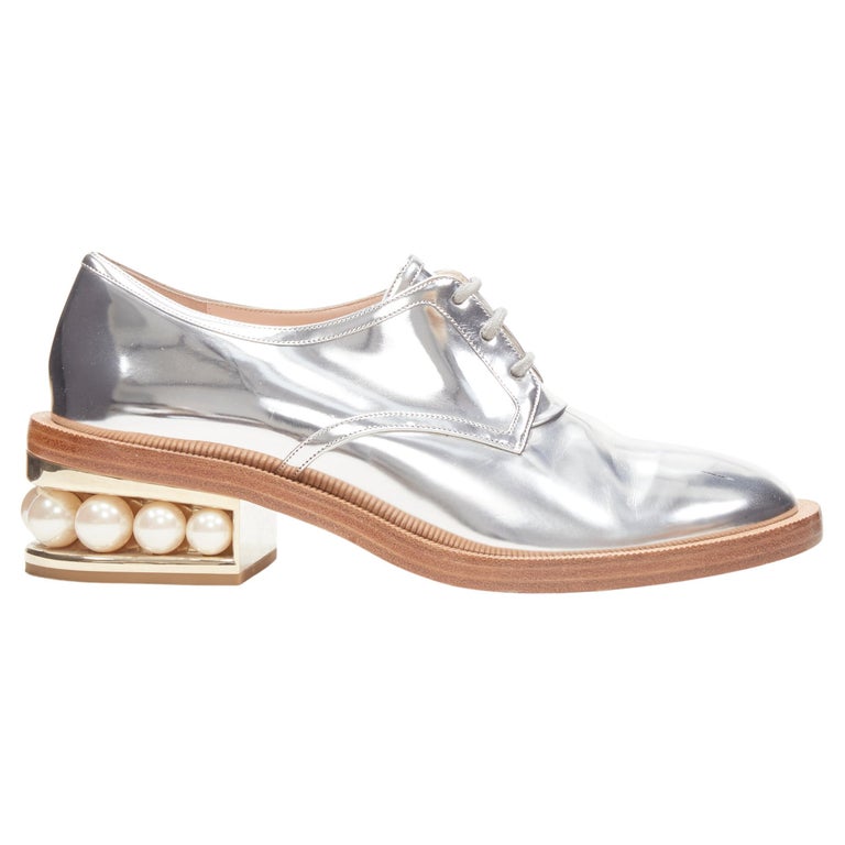 NICHOLAS KIRKWOOD metallic silver pearl embellished gold heel brogue ...