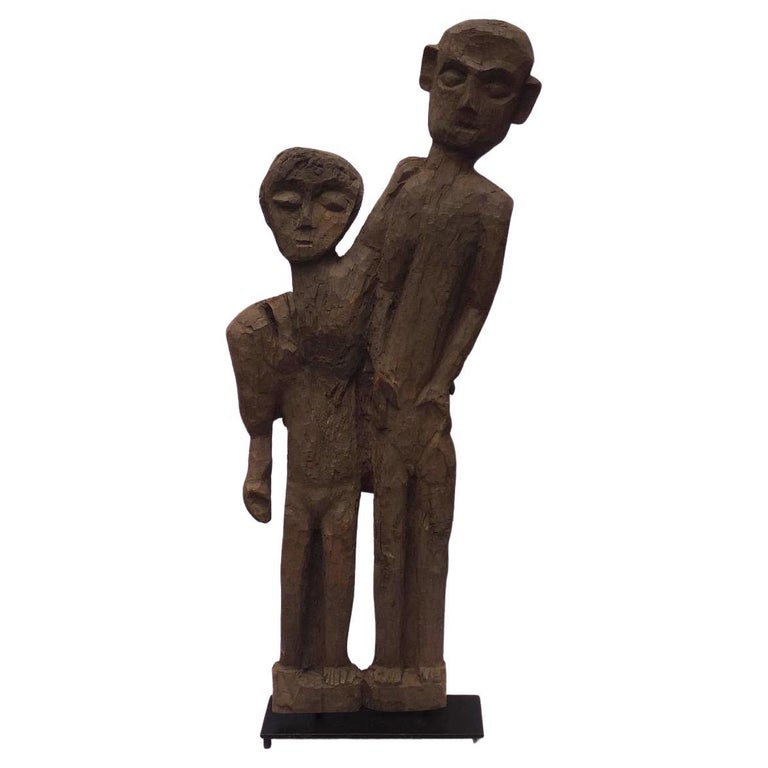 Old 4 foot high naive and stylized carving of two people from 1 slab of ...