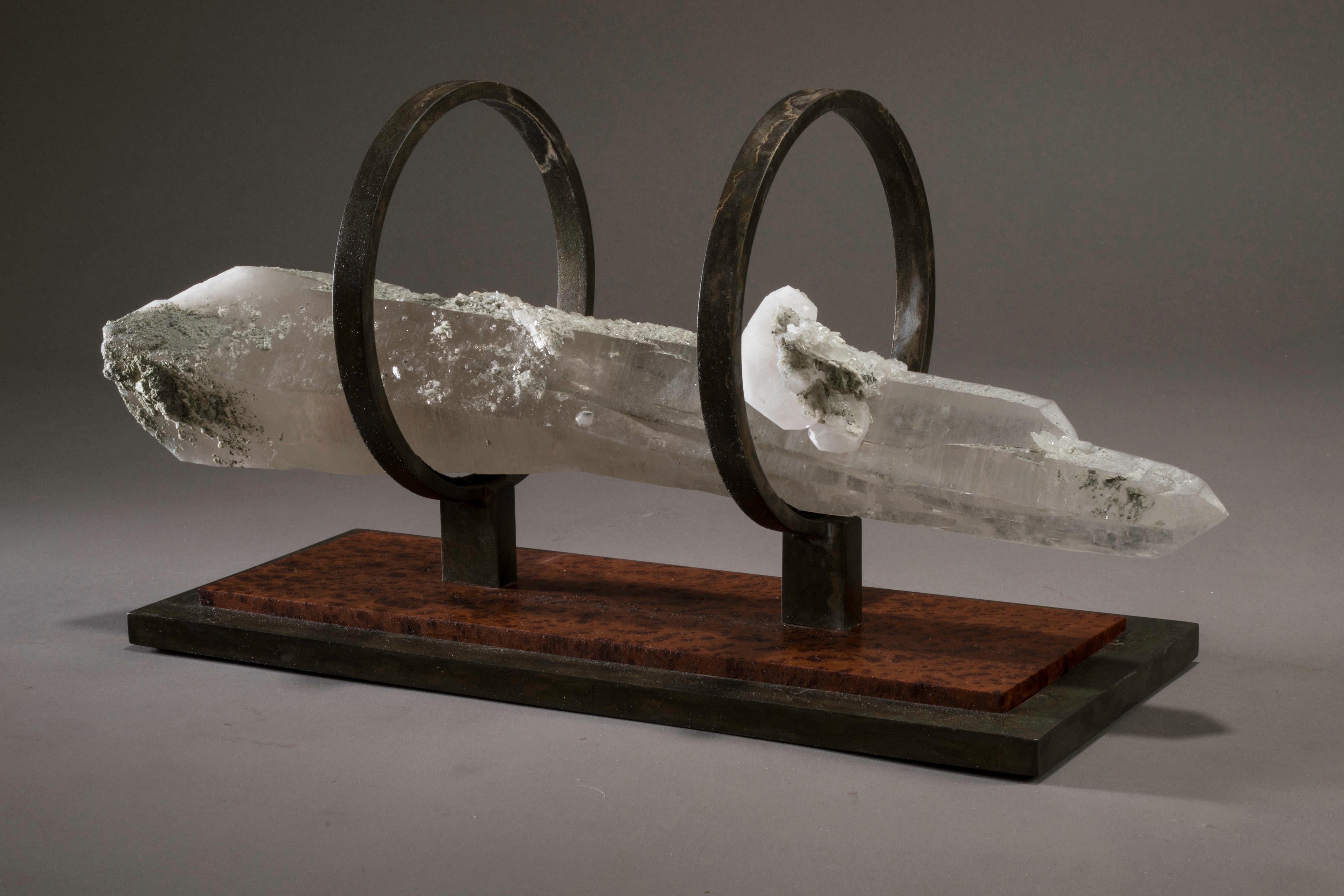 Quartz mineral suspended by Iron Loops over Burl Base For Sale at 1stDibs