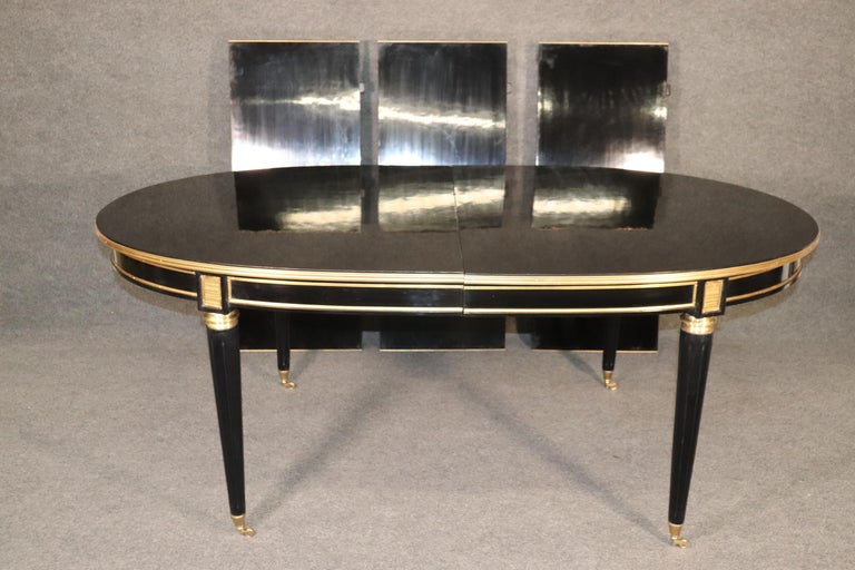 Opulent Black Lacquer and Brass Trimmed Dining Table in the manner ...