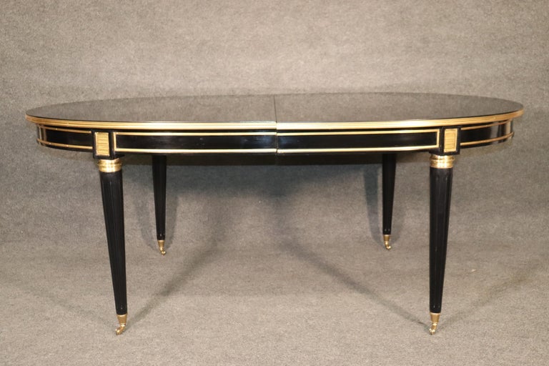 Opulent Black Lacquer and Brass Trimmed Dining Table in the manner ...