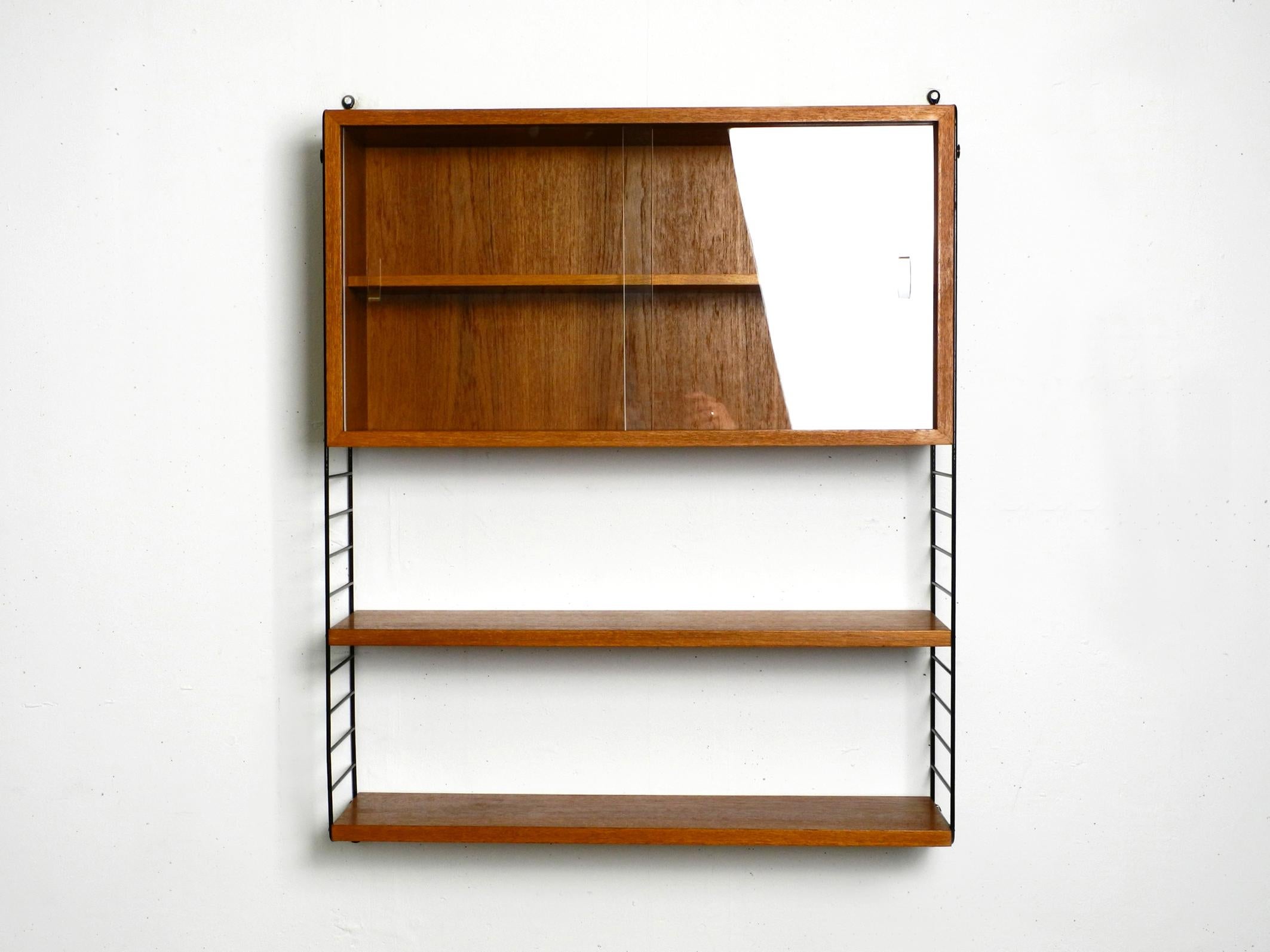 Original 1960s Nisse Strinning Teak String Shelf with Sliding Glass Door Cabinet For Sale at 1stDibs