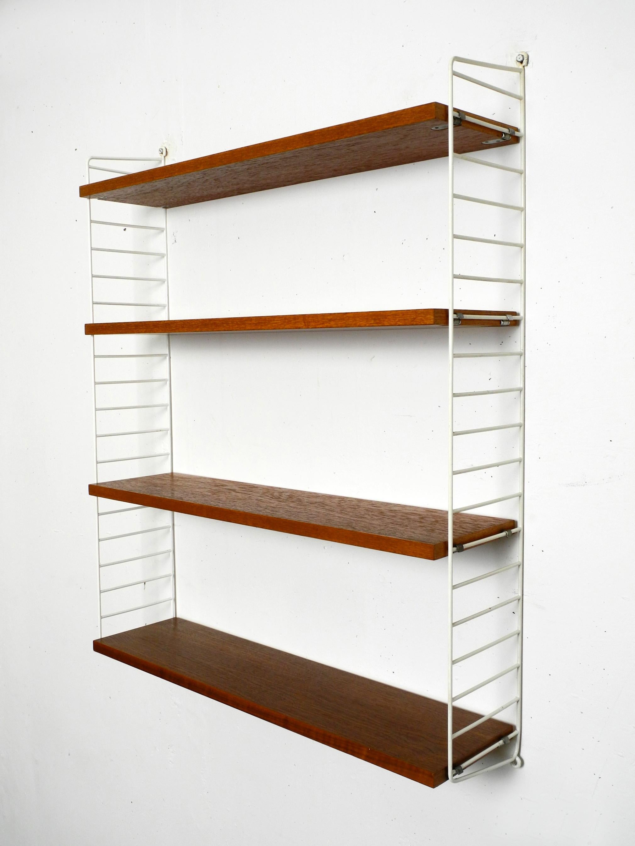 Original 1960s teak Nisse Strinning wall hanging shelf with 4 shelves ...
