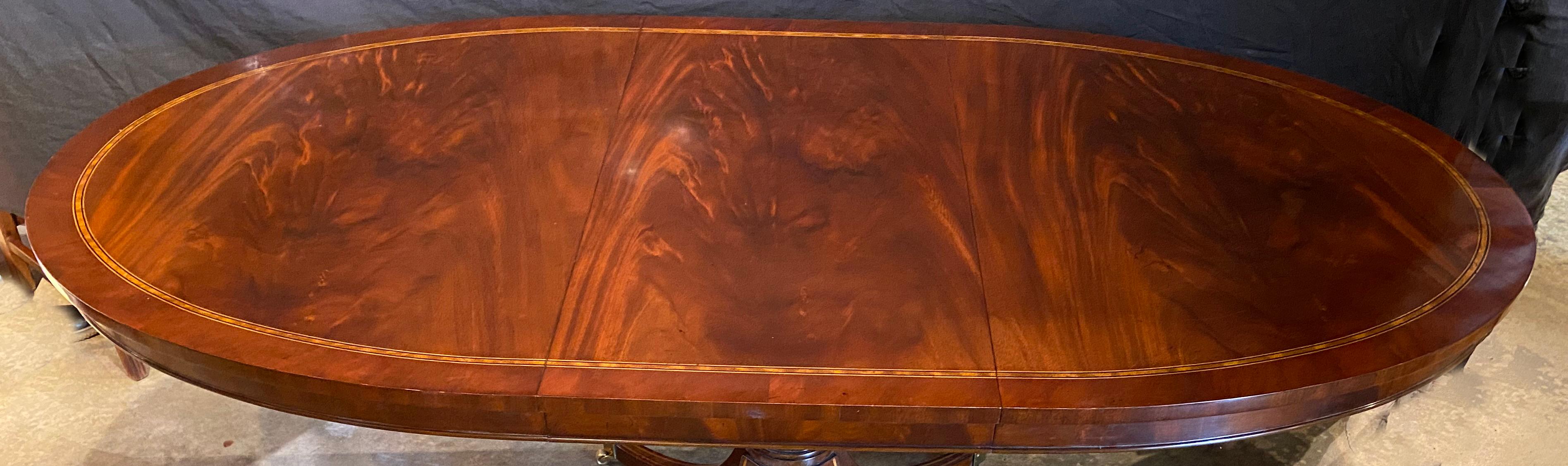 Oval Banded Mahogany Single Pedestal Dining Table with One Leaf at 1stDibs