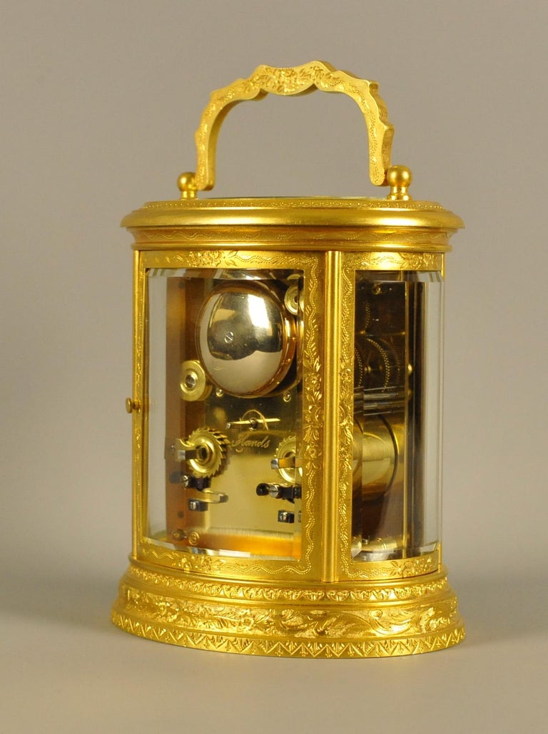 Oval Engraved Bell Striking Carriage Clock with Case For Sale at 1stDibs