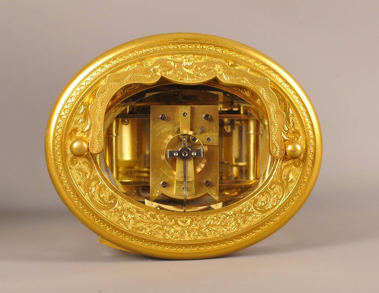 Oval Engraved Bell Striking Carriage Clock with Case For Sale at 1stDibs