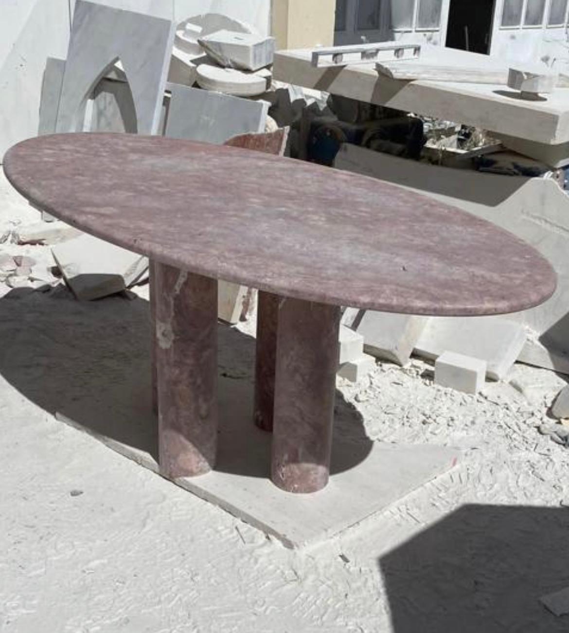Oval Red Travertine Dining Table with Column Legs in the style of Mario ...