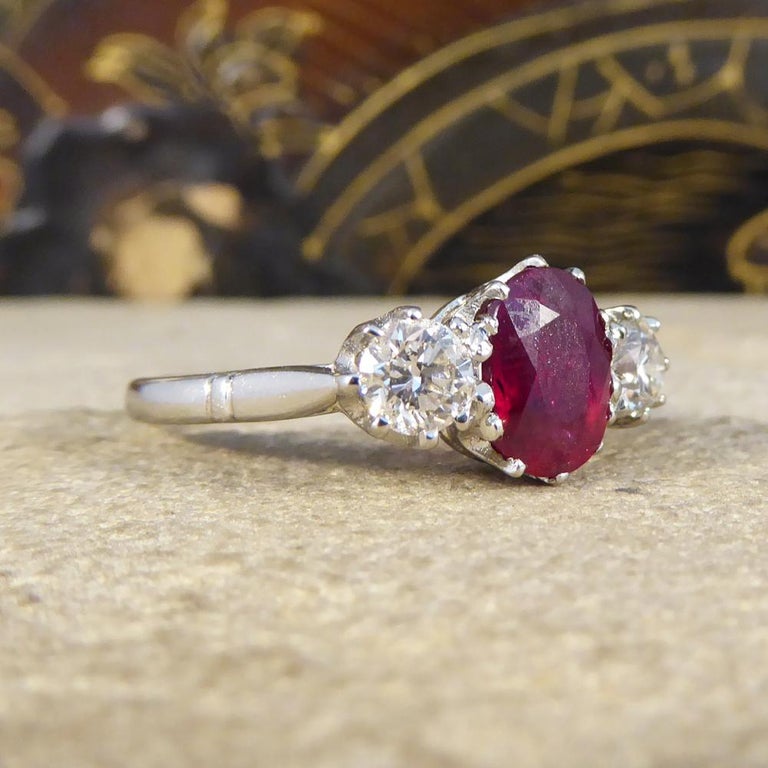 Oval Ruby and Diamond Three-Stone Engagement Ring in Platinum at 1stDibs