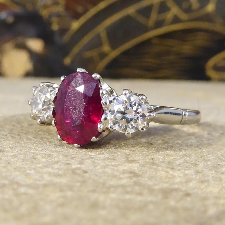 Oval Ruby and Diamond Three-Stone Engagement Ring in Platinum at 1stDibs