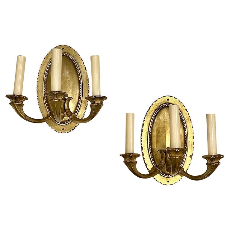 Oval Shaped Bronze Three-Arm Sconces For Sale at 1stDibs