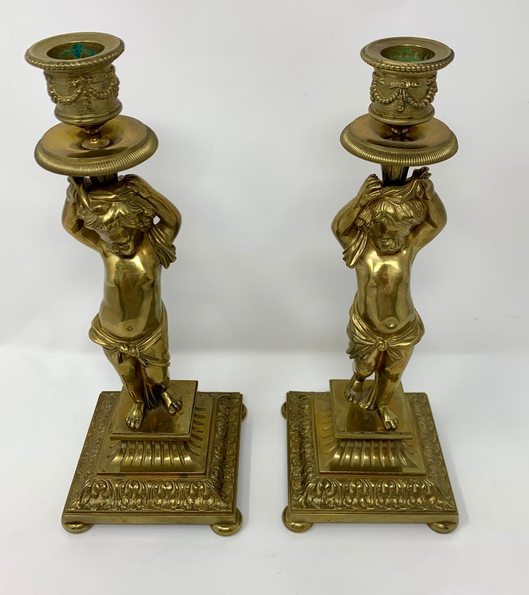 Pair of Antique French Gold Bronze Cupid Candlesticks For Sale at 1stDibs