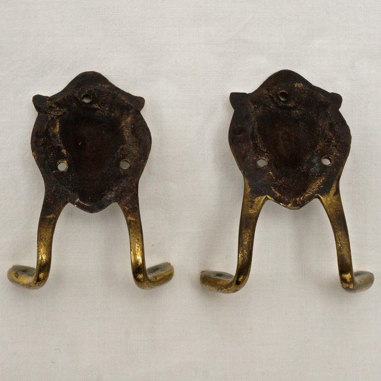 Pair French Brass Lion Head Design Double Hooks For Sale at 1stDibs