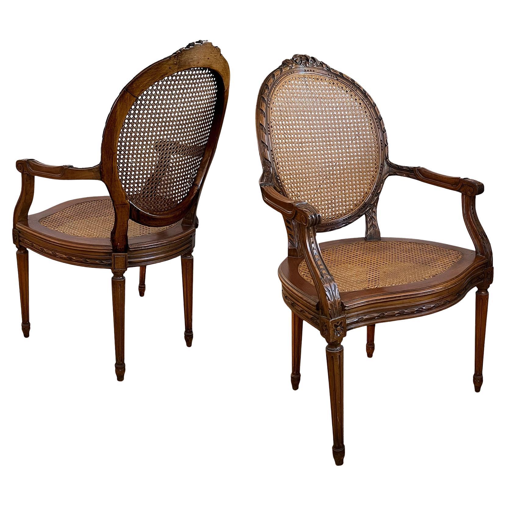 French Louis XV Provincial Style Carved Walnut Cane Back Arm Chairs - a ...