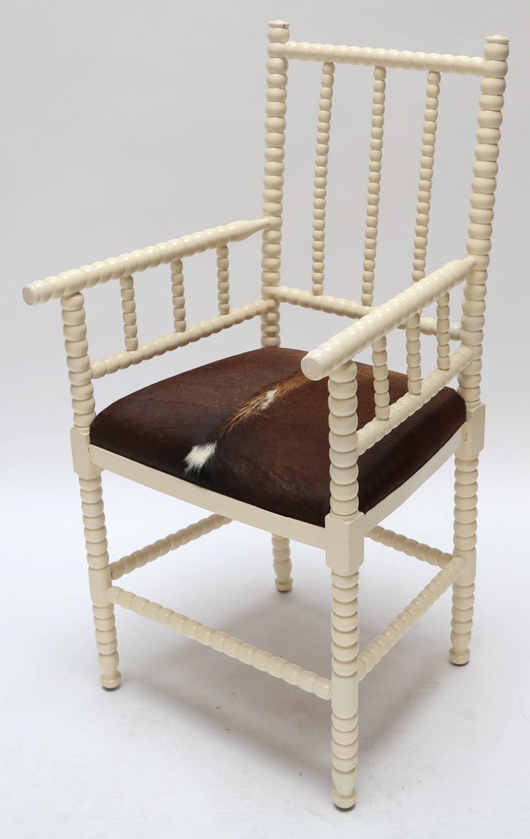 Pair of 1940s Ivory Spool Armchairs in Brown Cow Hide For Sale at 1stDibs