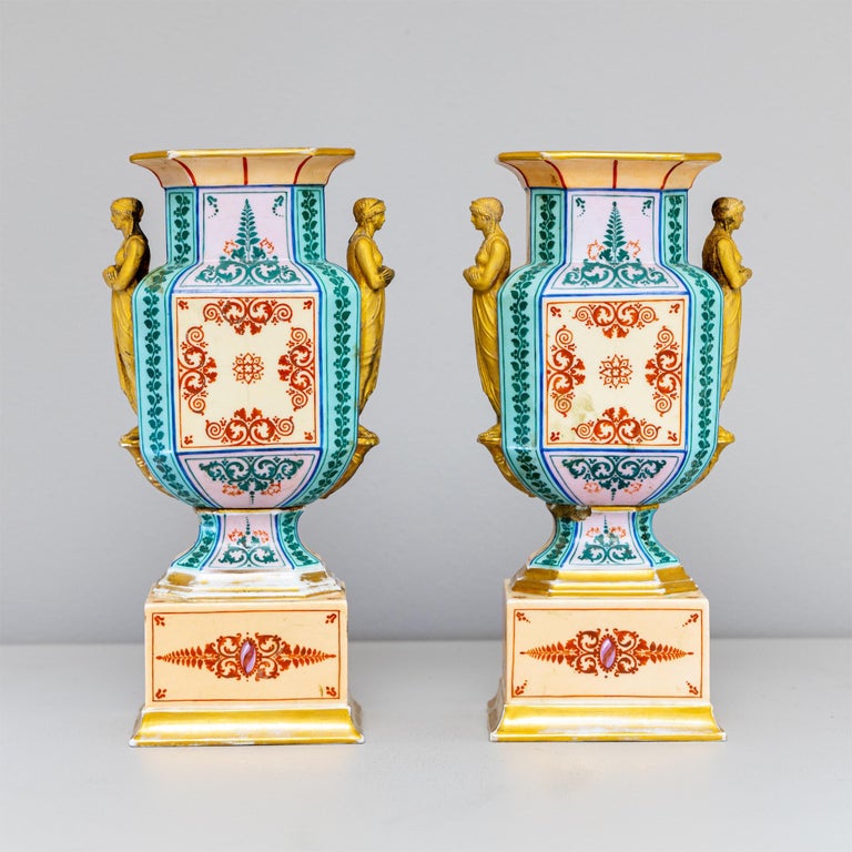 Pair of Ceramic Amphoras with figurative Scenes, Blue and Gold, around ...