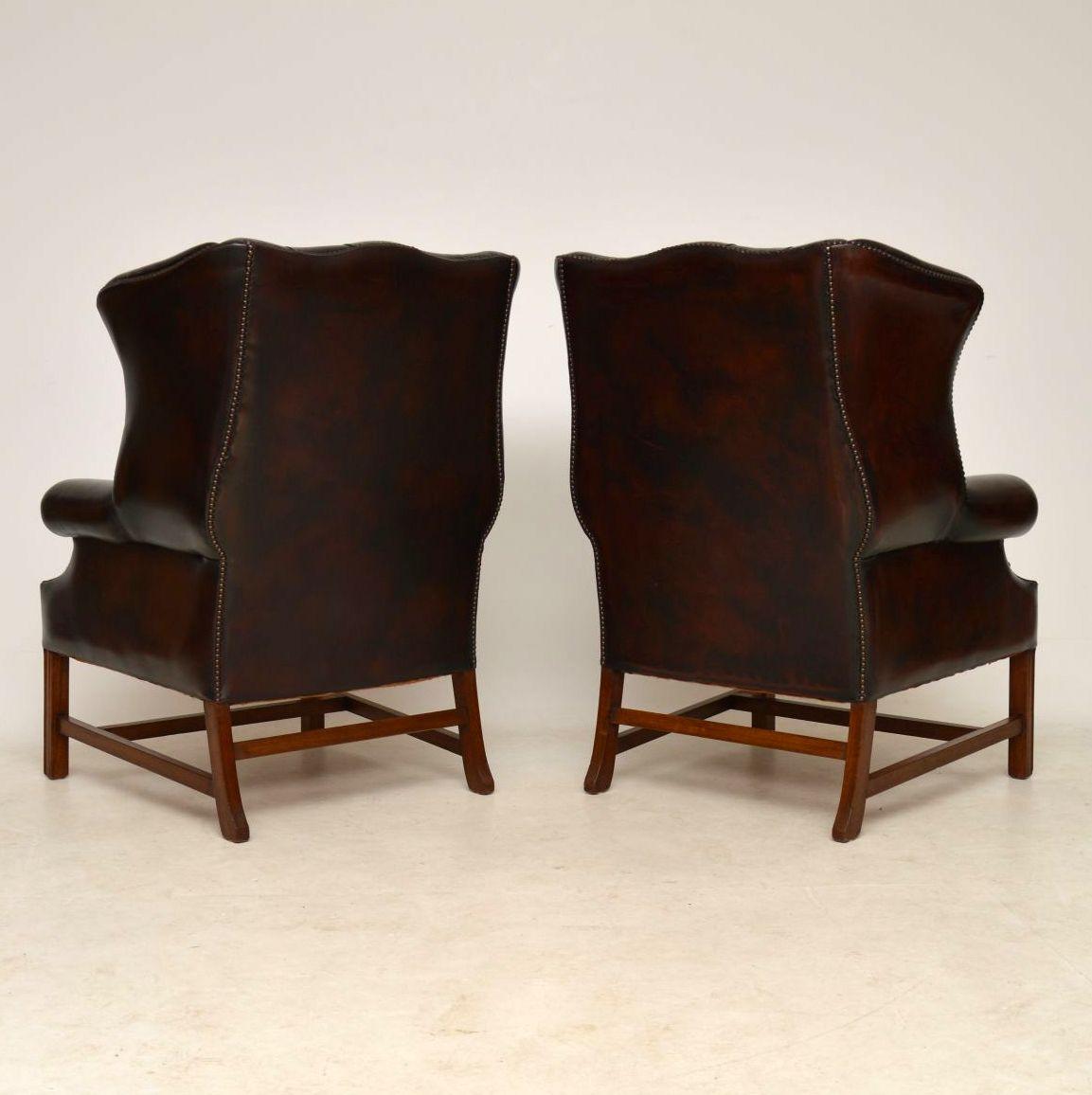 Pair of Antique Leather Wing Back Armchairs at 1stDibs