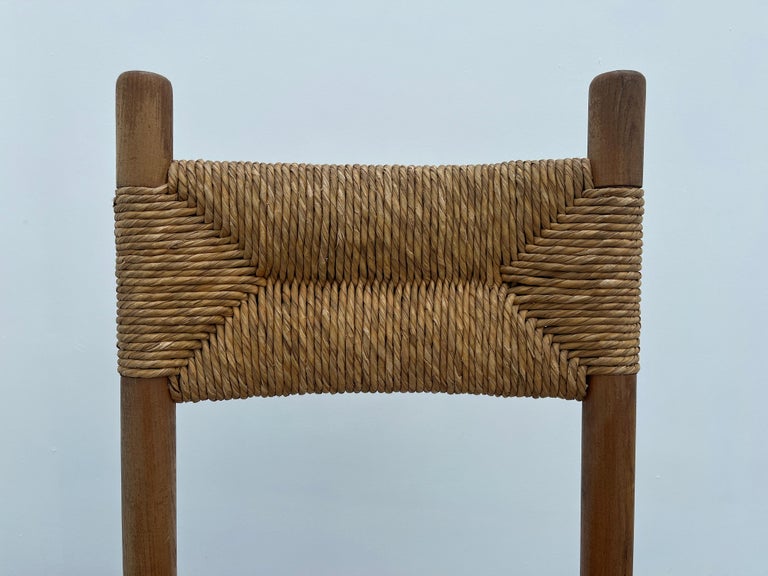 Pair of beechwood chairs with straw seat in the style of Charlotte ...