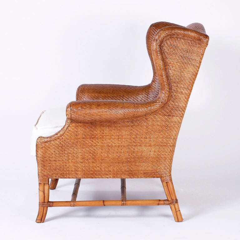 Pair of British Colonial Wicker and Bamboo Wing Chairs by Baker at 1stDibs