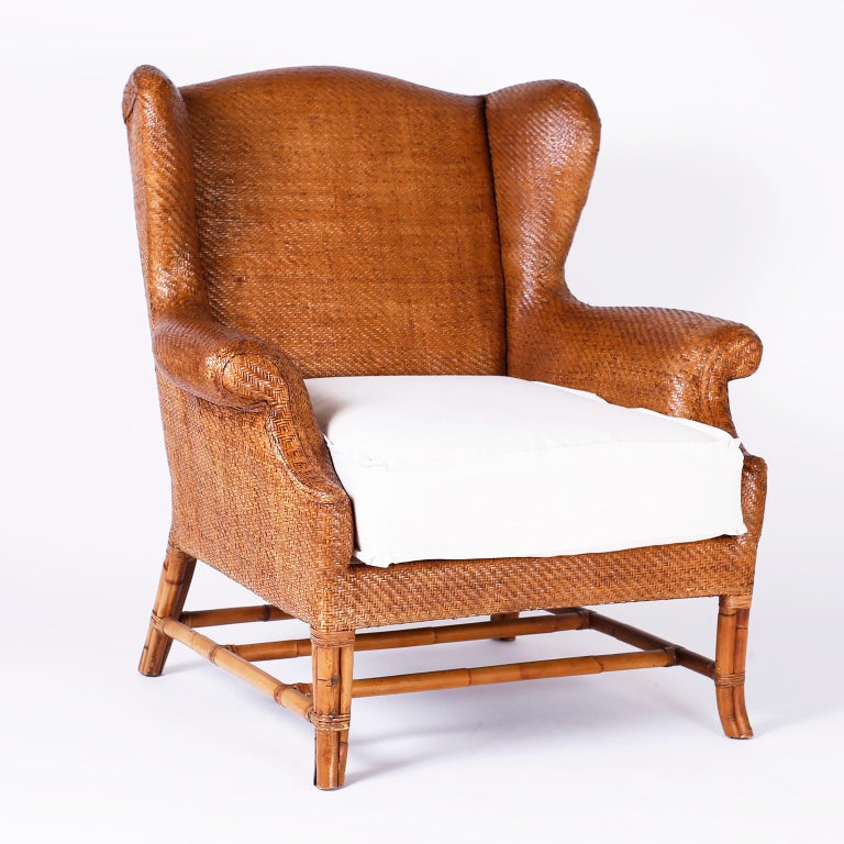 Pair of British Colonial Wicker and Bamboo Wing Chairs by Baker at 1stDibs