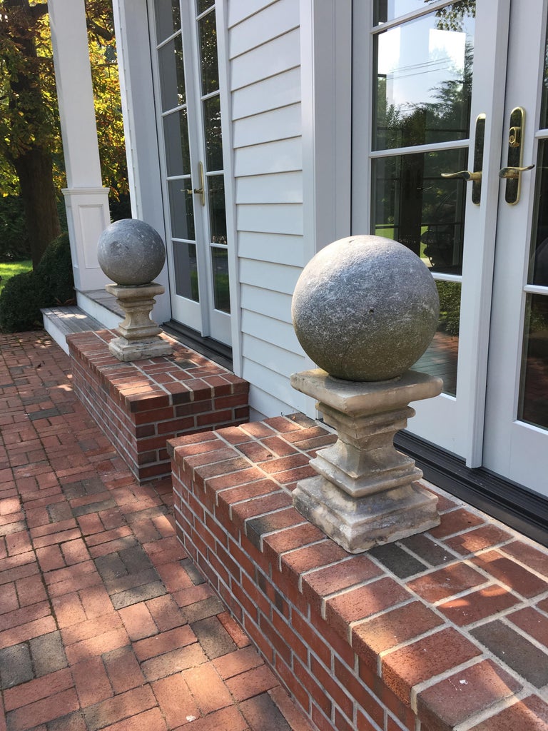 Pair of Cast Stone Garden Balls Atop Stone Pedestals at 1stdibs