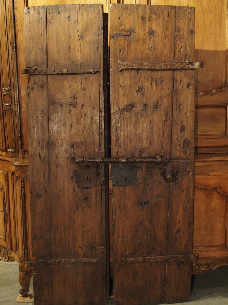 Pair of circa 1700 Italian Larch Wood Doors with Nailheads at 1stDibs