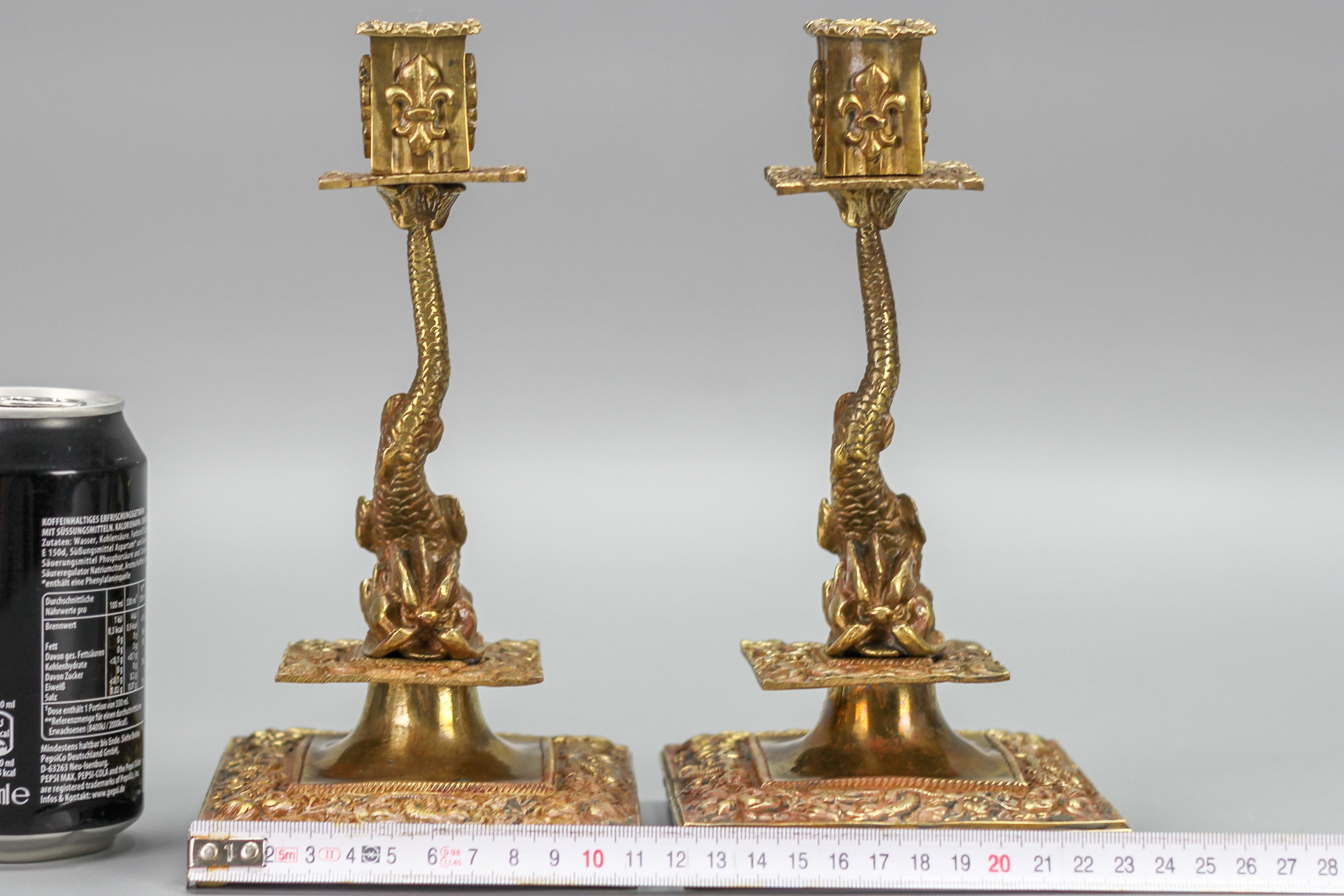 Pair of French Brass Candlesticks with Dolphin Figures For Sale at 1stDibs