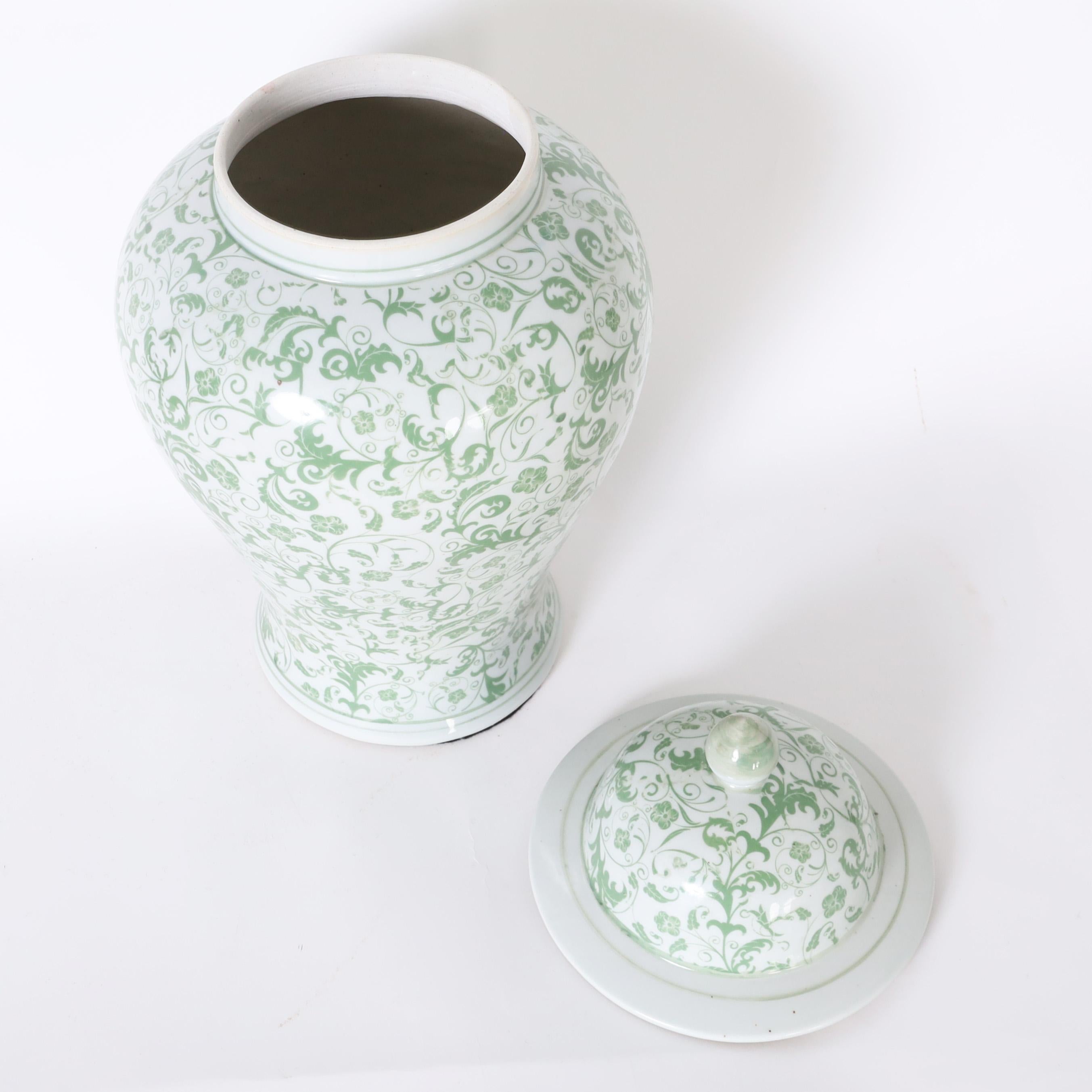 Pair of Green and White Lidded Urns or Jars For Sale at 1stDibs