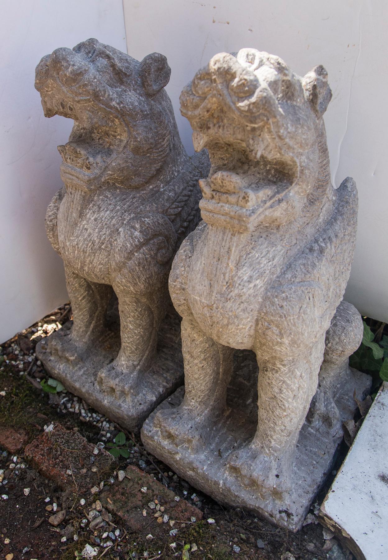 Pair of Hand Carved Stone Winged Beasts For Sale at 1stDibs