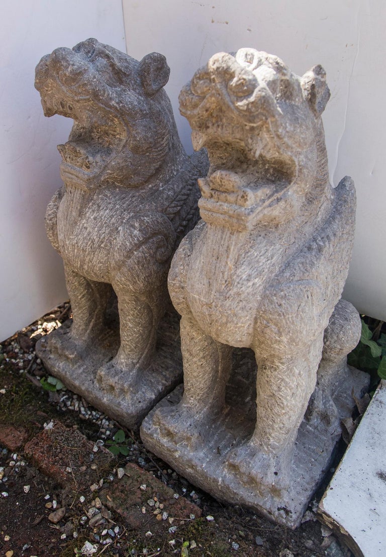 Pair of Hand Carved Stone Winged Beasts For Sale at 1stDibs