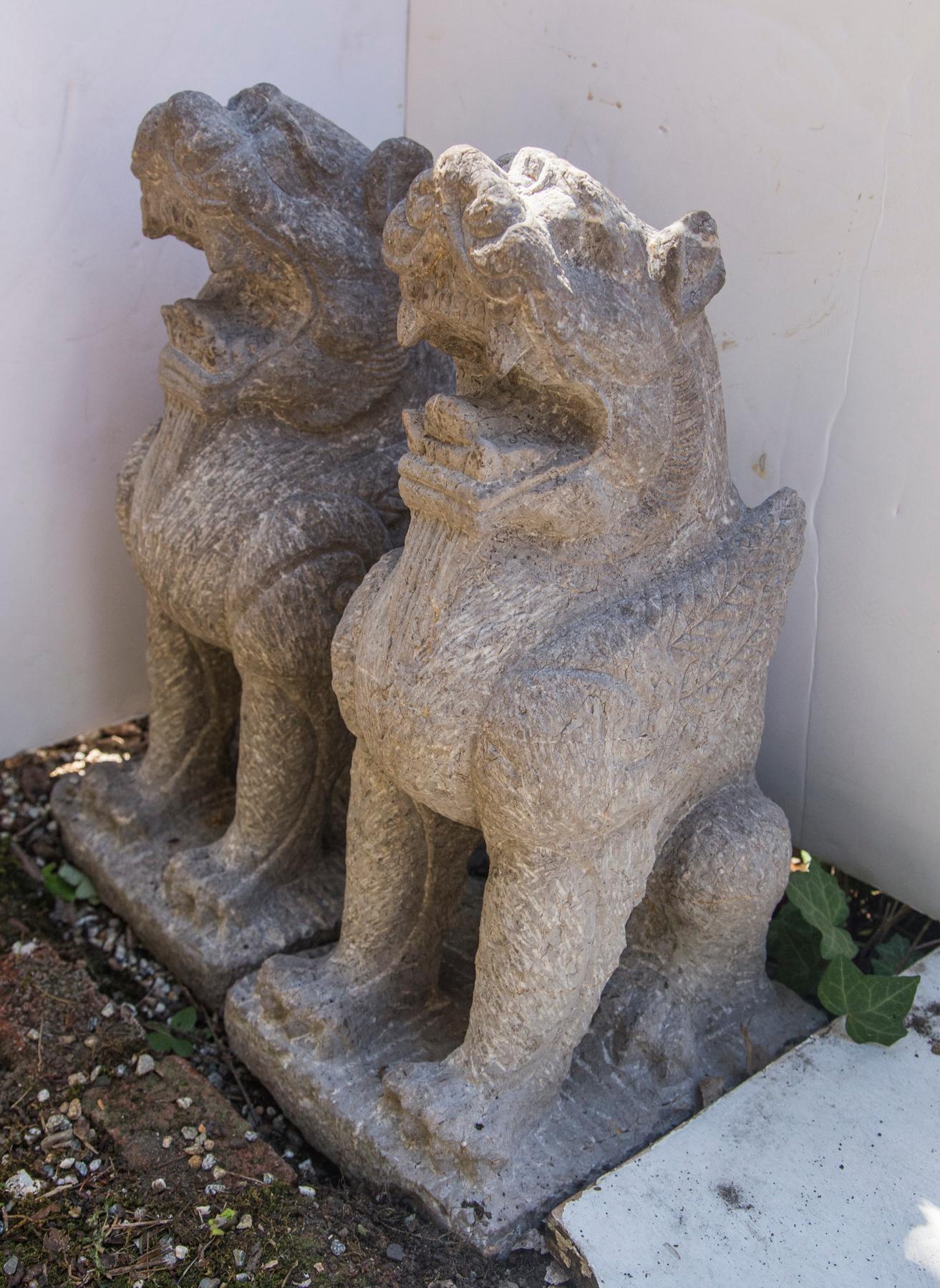 Pair of Hand Carved Stone Winged Beasts For Sale at 1stDibs